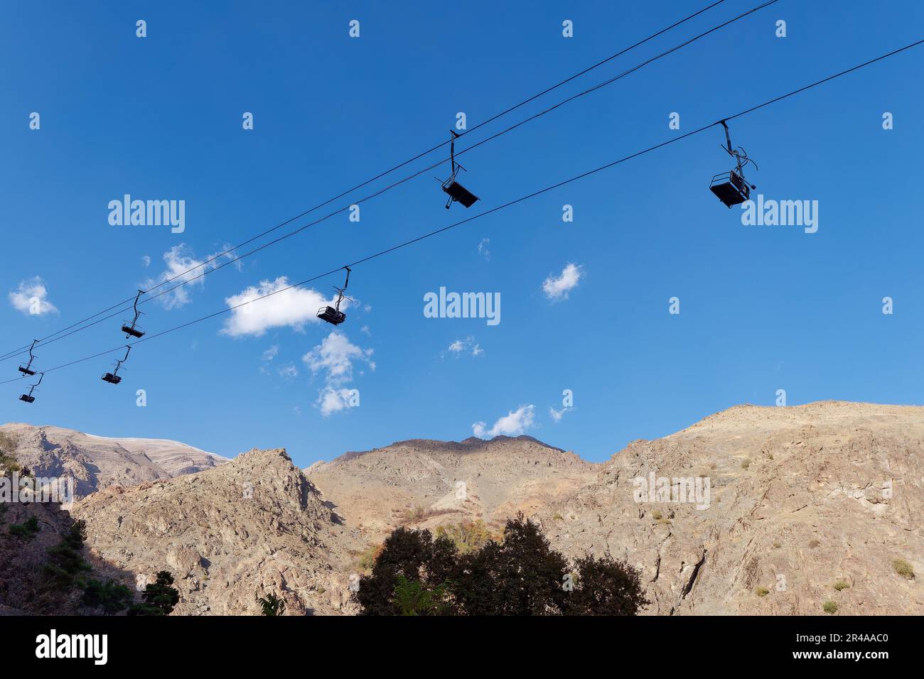 An aerial view of the Alborz mountains with cable cars transporting ...