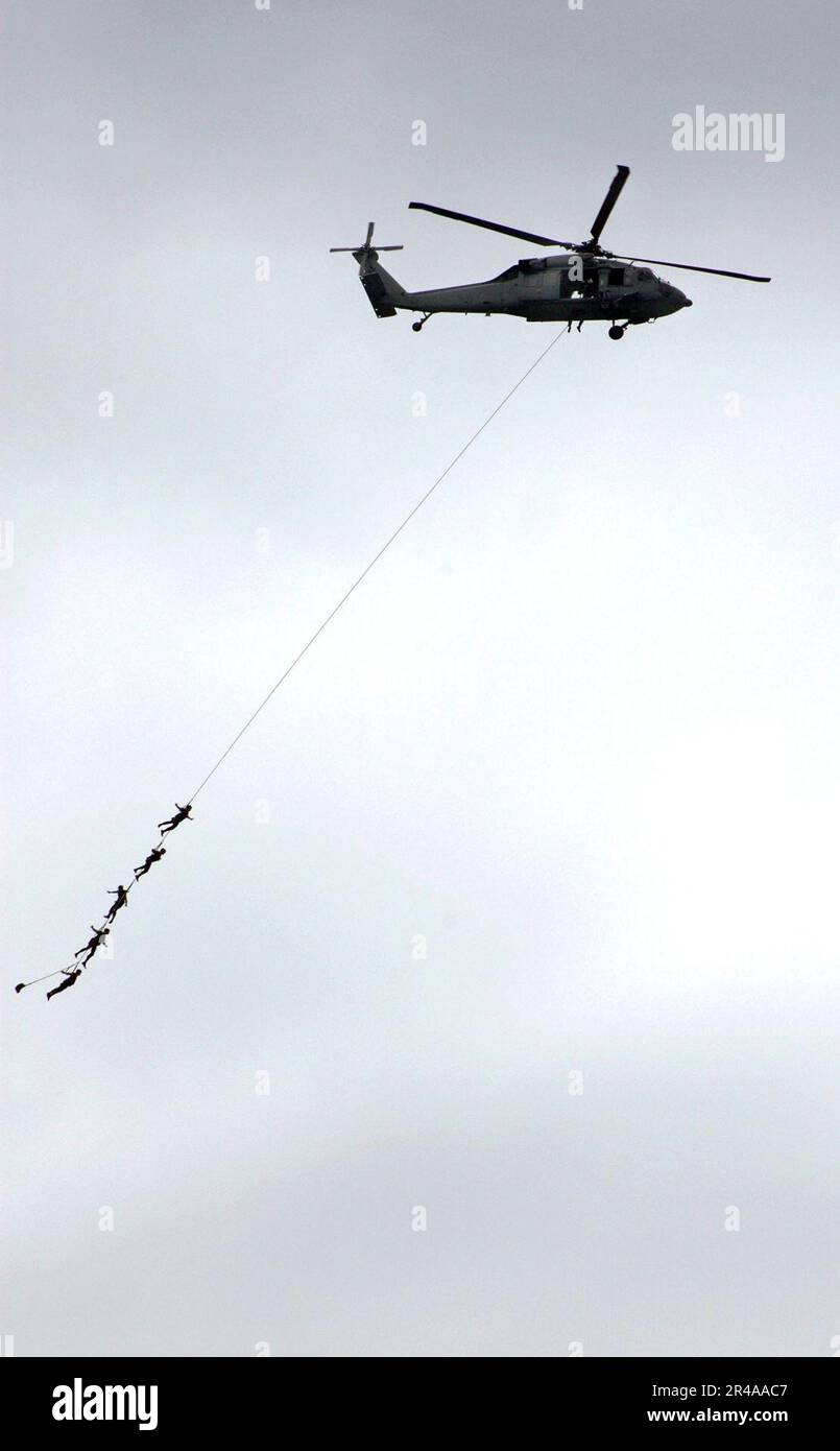 US Navy Five Sailors assigned to Explosive Ordnance Disposal Mobile ...