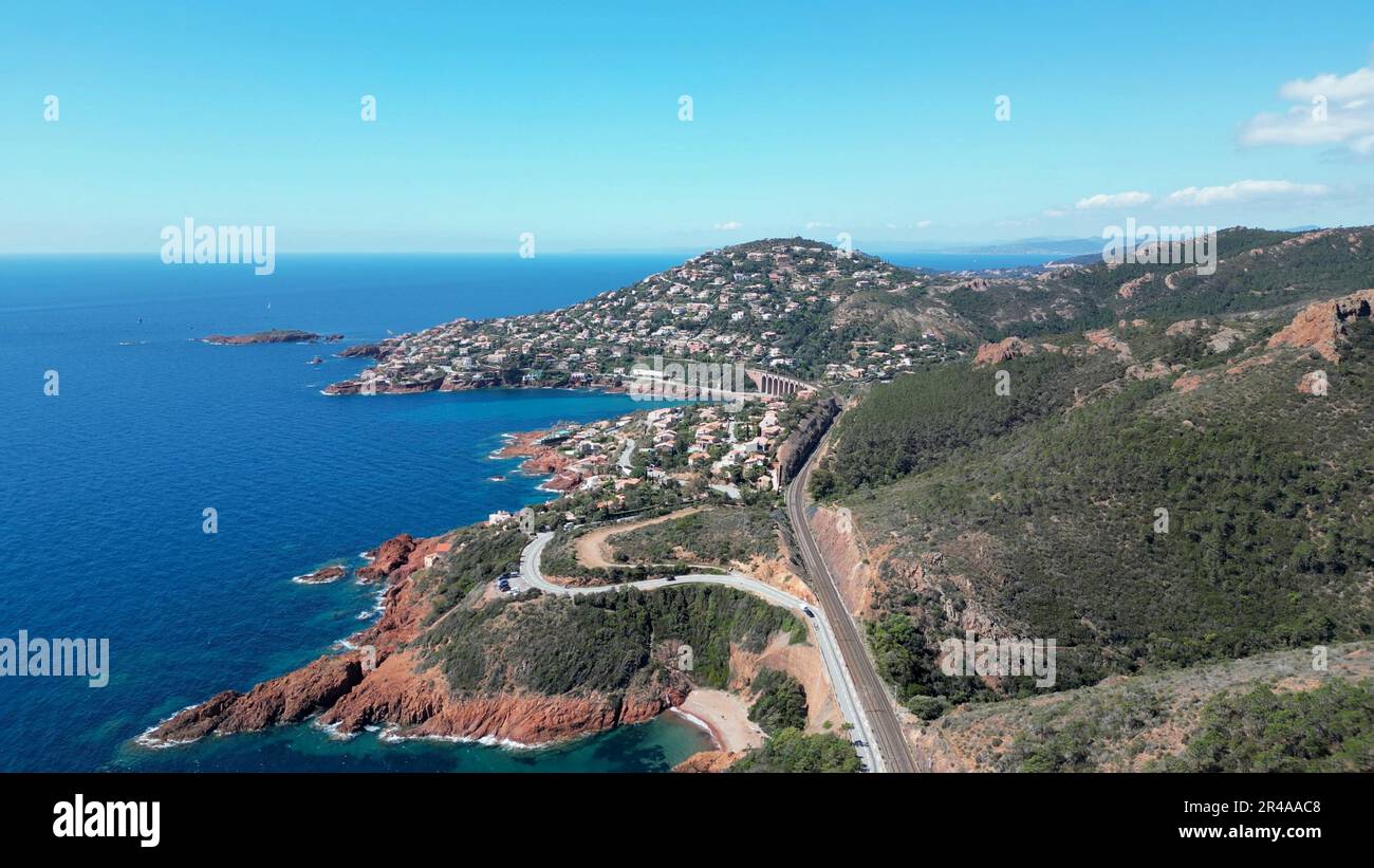 An aerial view of a highway winding through a coastal landscape of ...