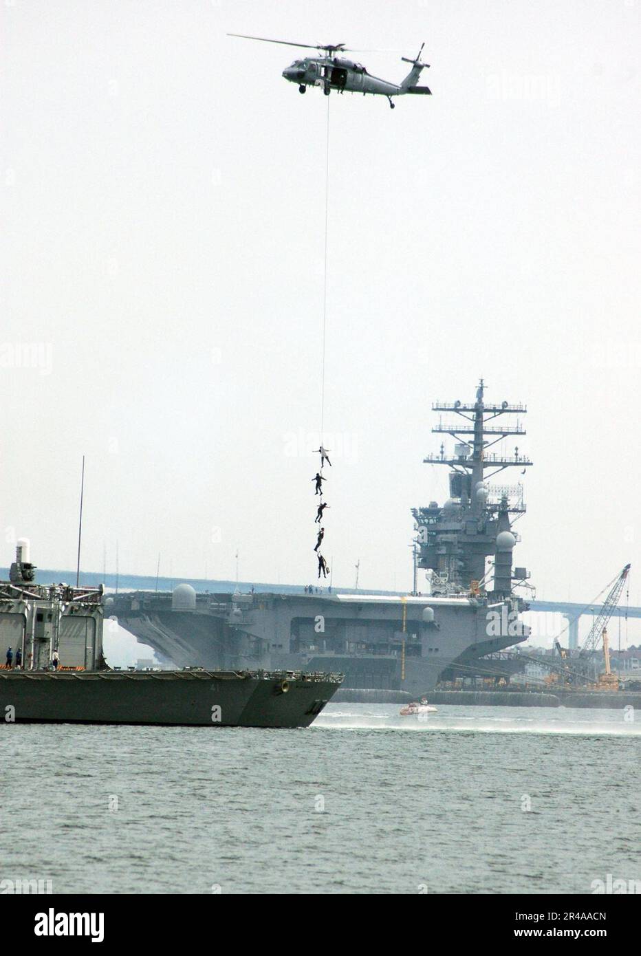 US Navy Five Sailors assigned to Explosive Ordnance Disposal Mobile ...
