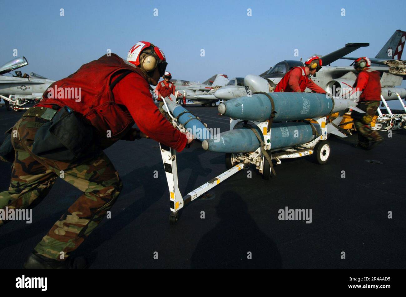 US Navy Aviation Ordnancemen move inert MK-83 1,000 lb training ...