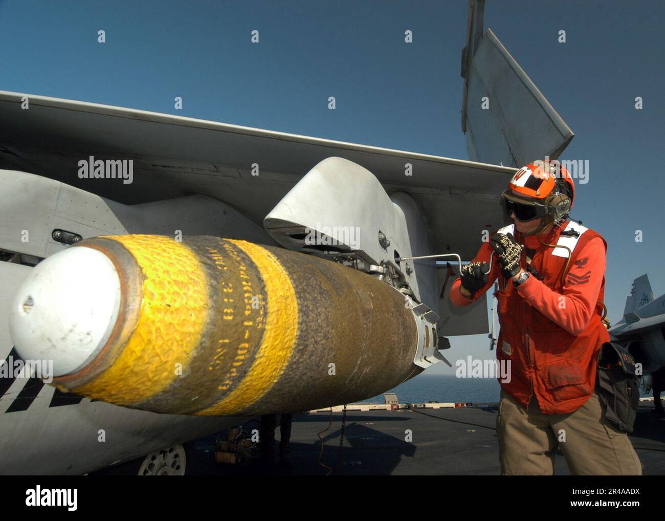 US Navy An Aviation Ordnanceman conducts final maintenance after ...