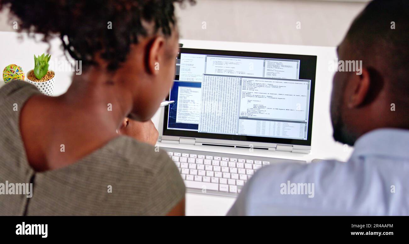 African American Coder Using Computer At Desk. Web Developer Stock ...