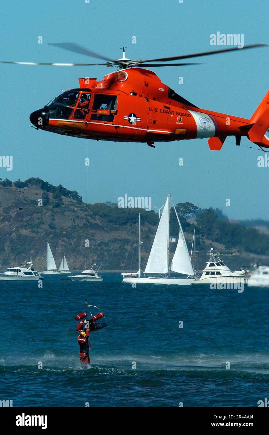 US Navy A U.S. Coast Guard HH-65A Dolphin helicopter performs an open ...