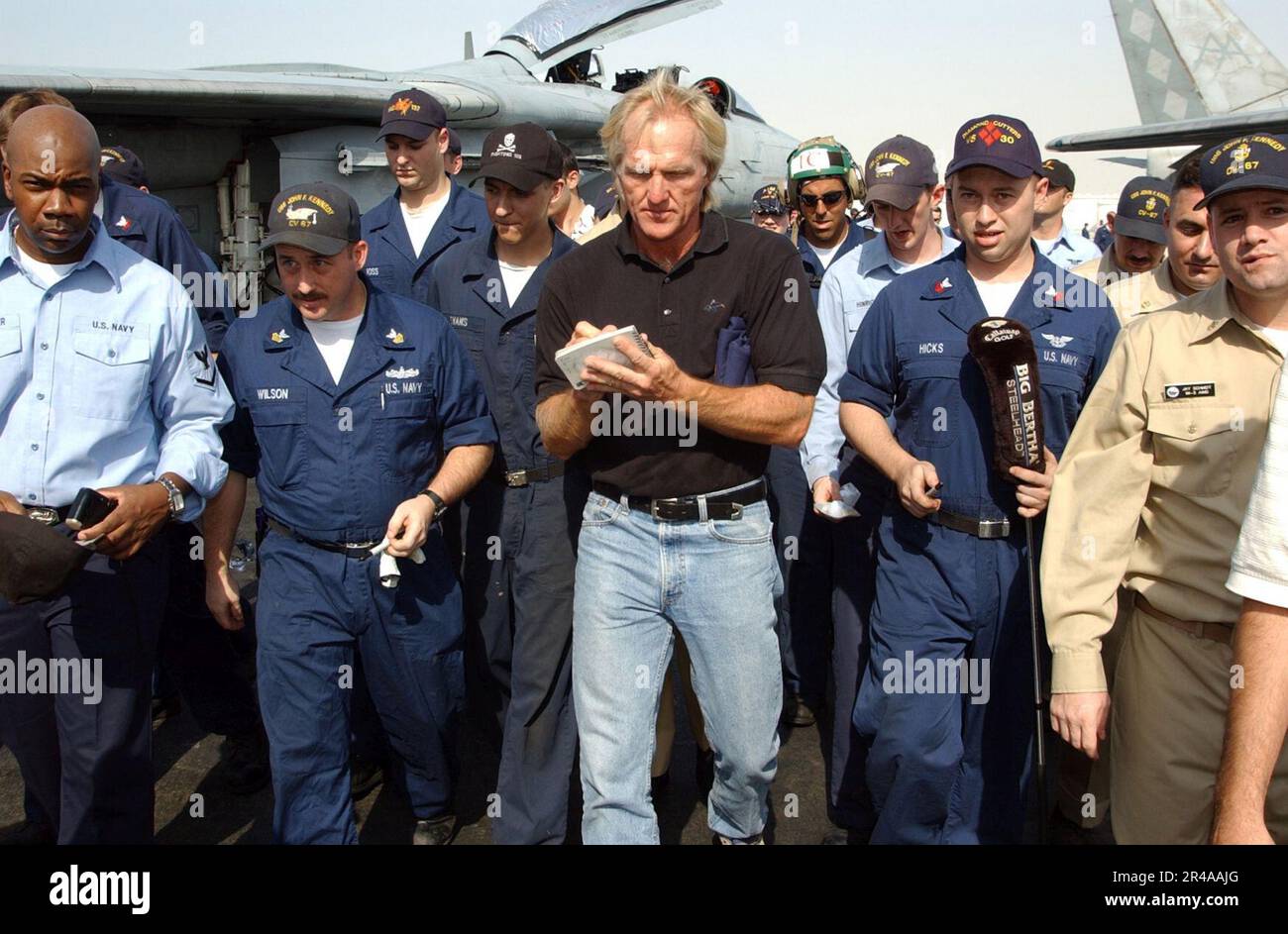 US Navy Professional golfer Greg Norman signs autographs for Sailors as ...