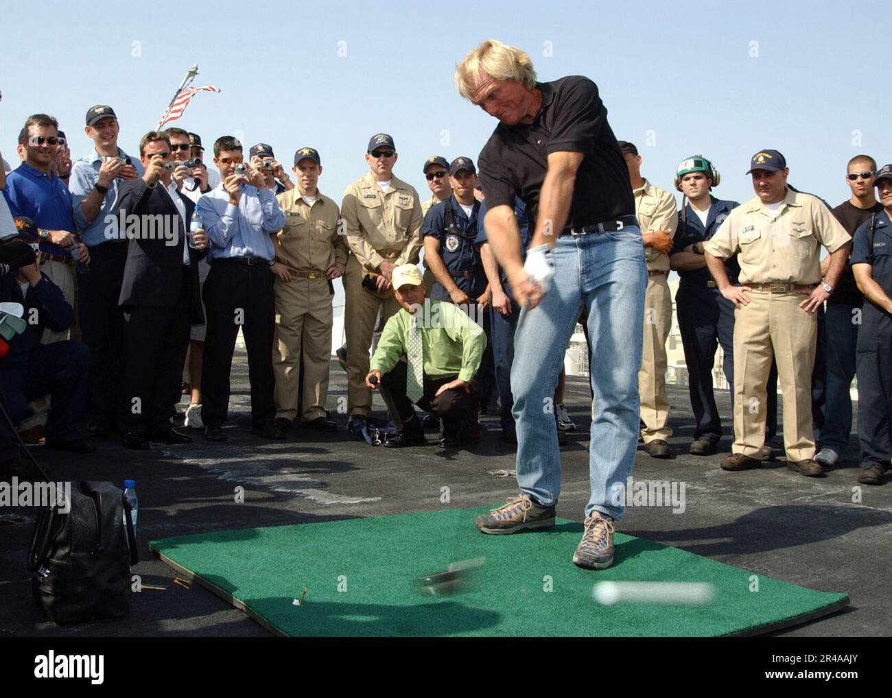 US Navy Professional golfer Greg Norman drives a golf ball off the ...