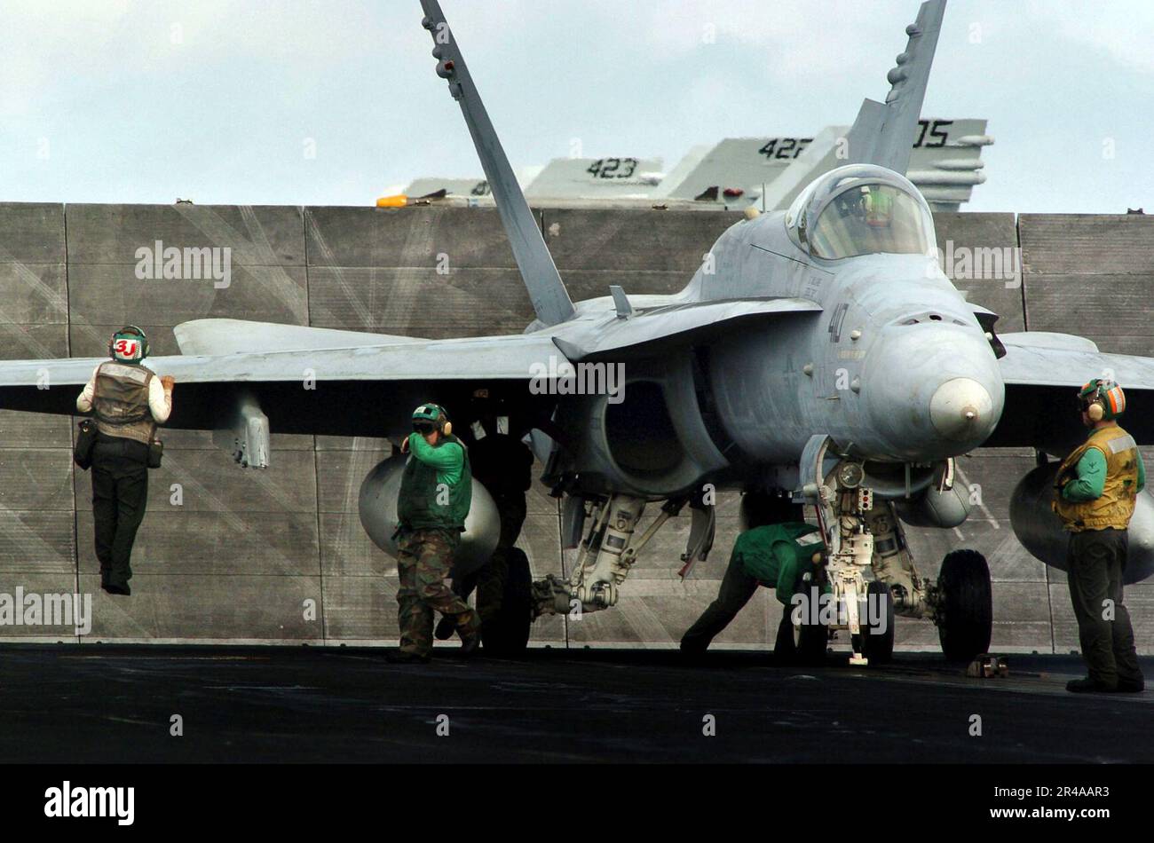 US Navy A final checker jumps skyward to inspect the aileron of an F-A ...