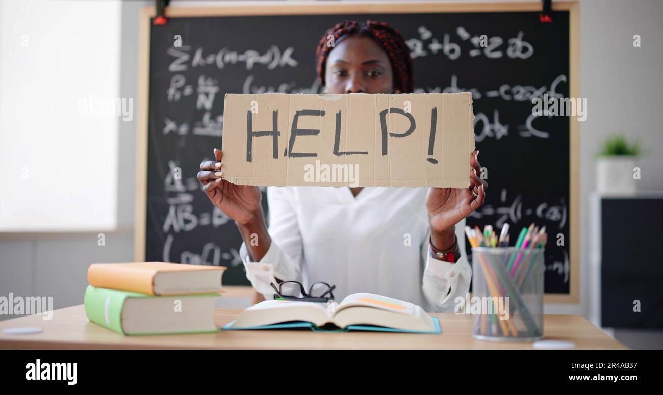 Frustrated Sad College Aftrican Teacher With Help Sign Stock Photo - Alamy