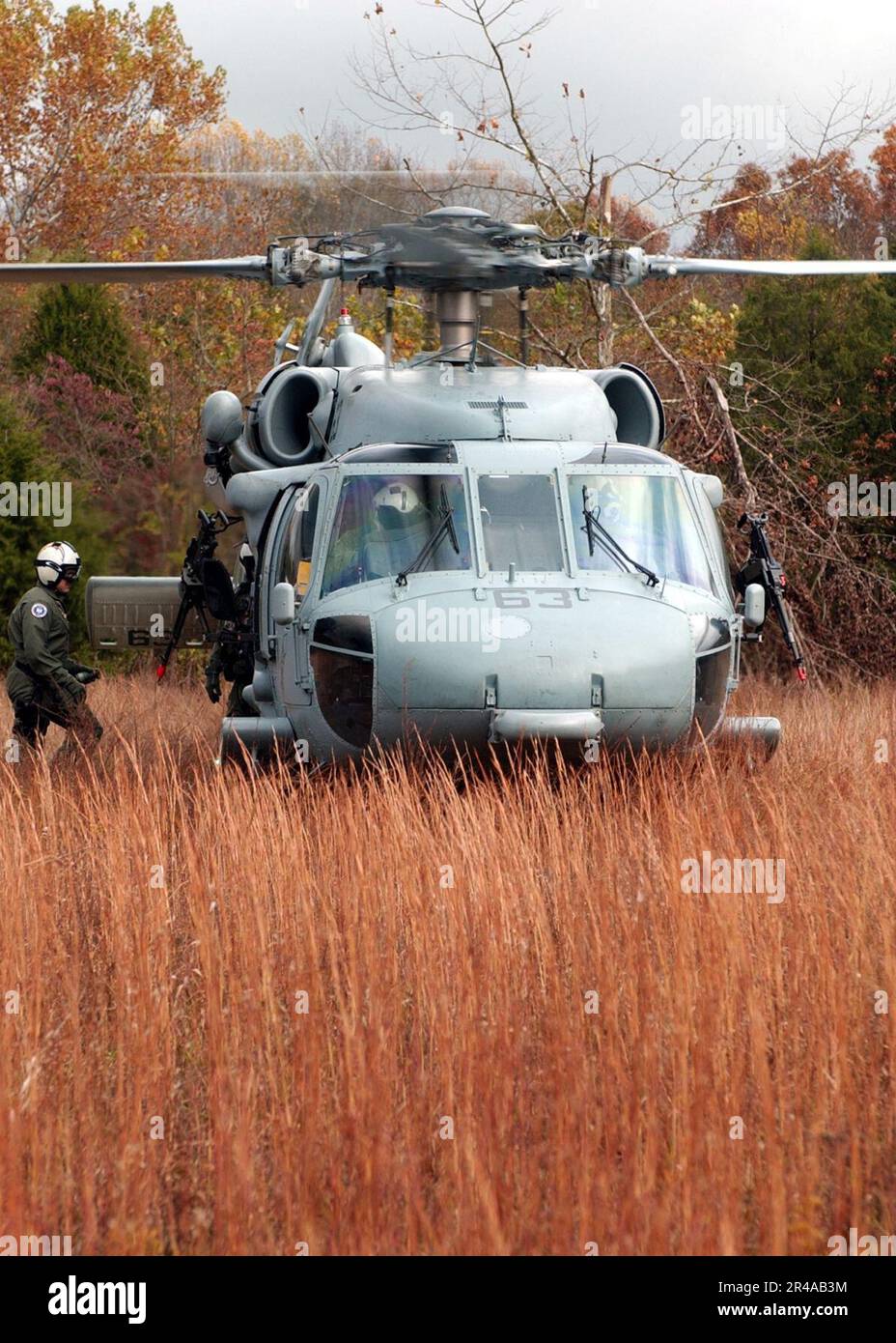 US Navy An MH-60S Knighthawk assigned to the Chargers of Helicopter ...