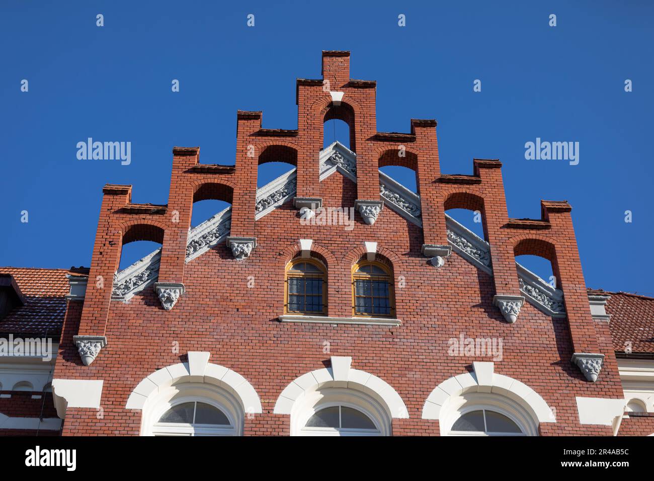 Topping the gable wall of a historic building in the Neo-Gothic style ...