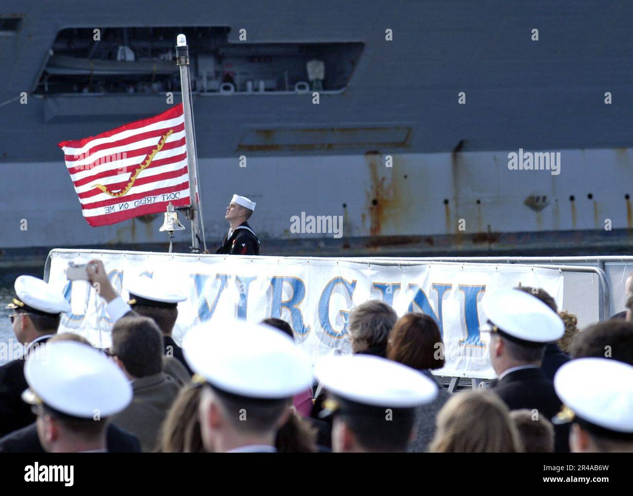 US Navy A Sailor raises the Union Jack as USS Virginia (SSN 774) is ...