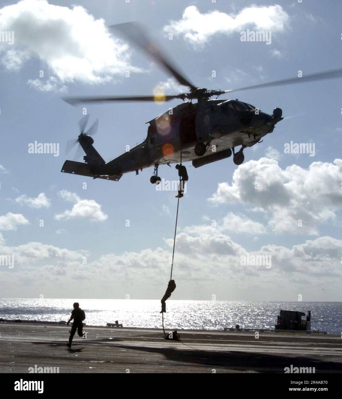 US Navy Personnel assigned to Explosive Ordnance Disposal Mobile Unit ...