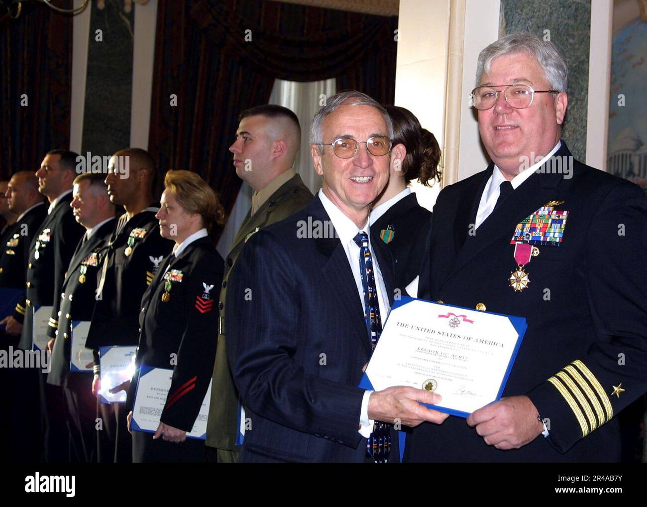 US Navy Secretary of the Navy, Honorable Gordon R. England, presents a ...