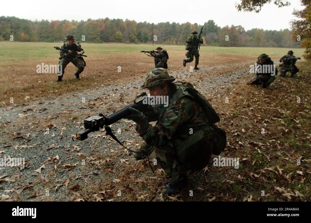 US Navy U.S. Navy combat photographers practice a center peel maneuver ...