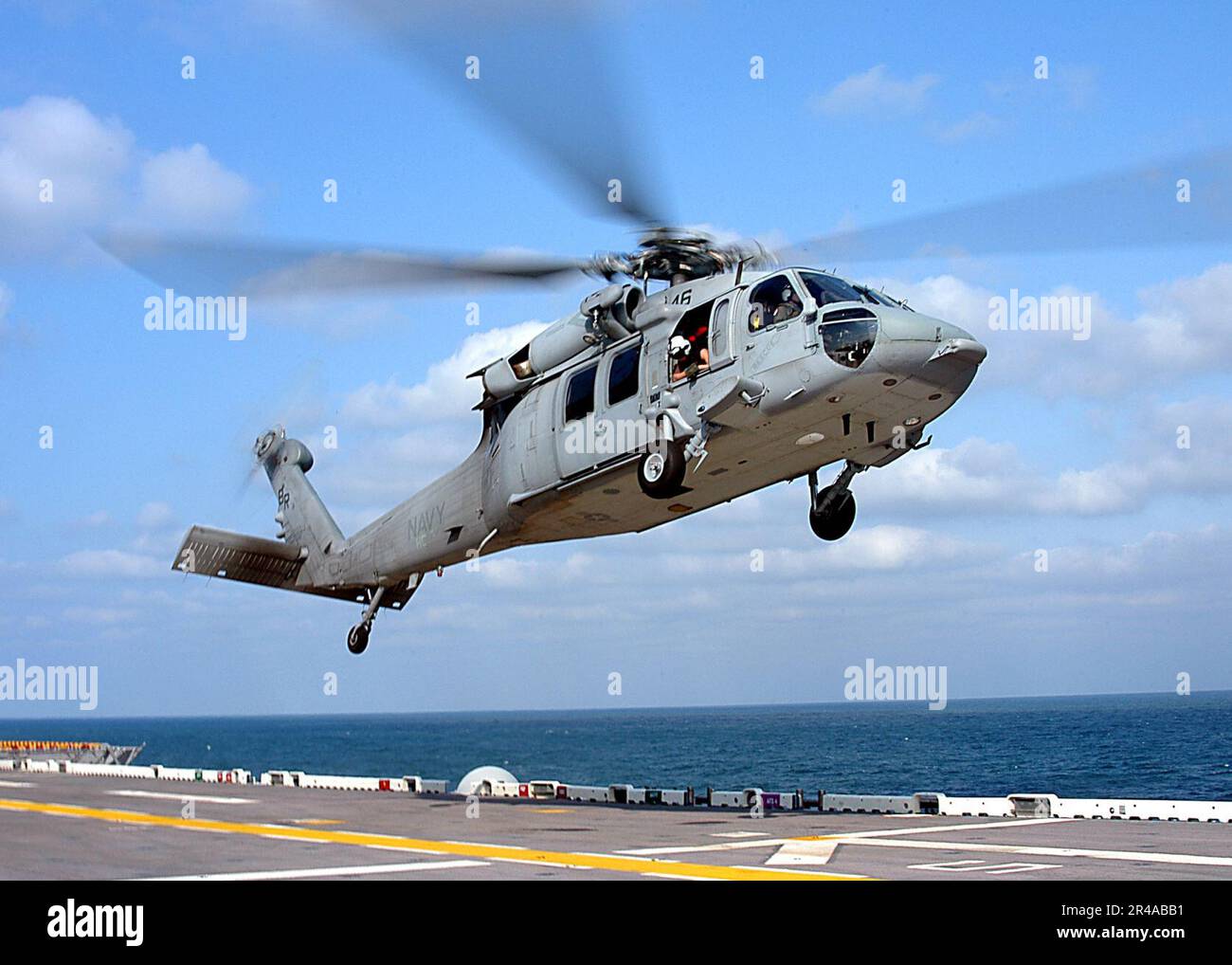 US Navy An MH-60S Knighthawk approaches the flight deck for a landing ...