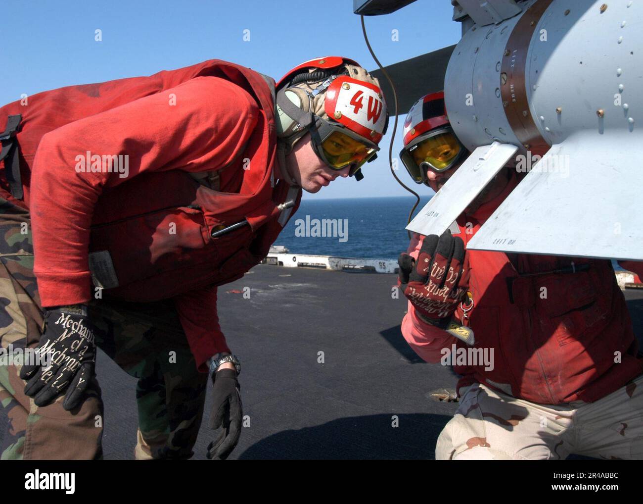 US Navy Aviation Ordnanceman 1st Class left, and Chief Aviation ...