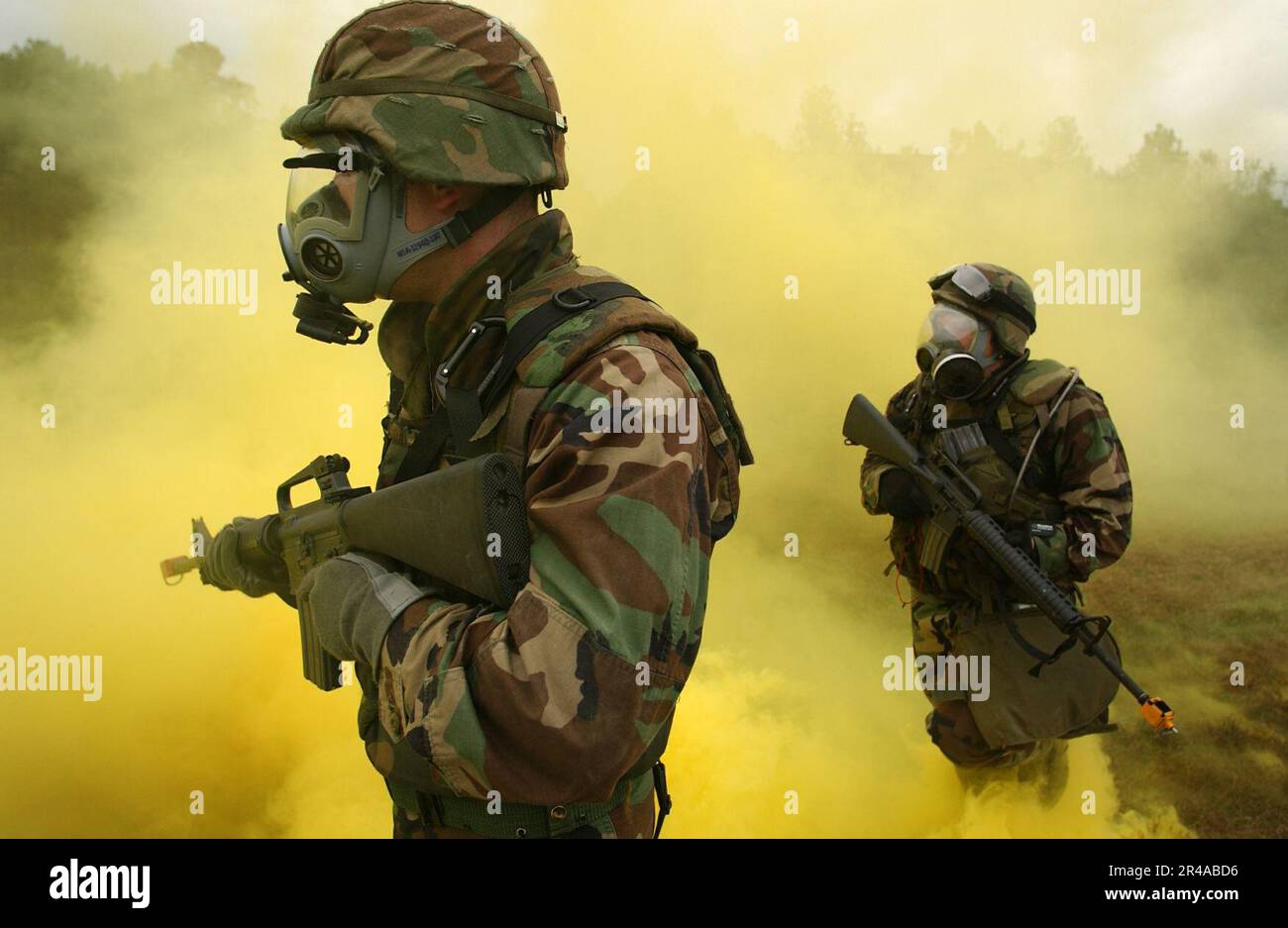 US Navy Sailors patrol through yellow smoke simulating Chemical ...