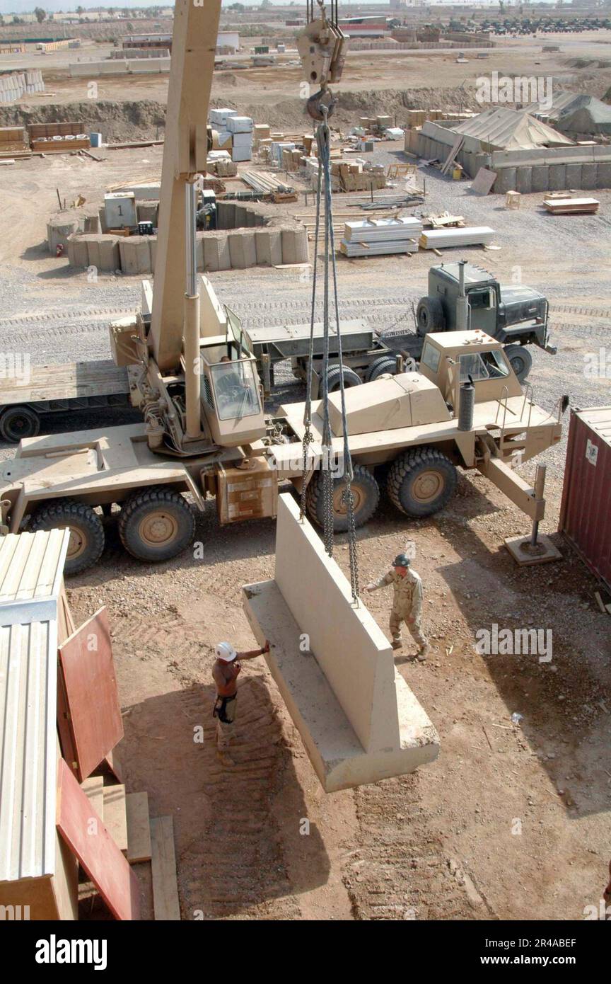 US Navy With the assistance of a U.S. Marine-operated crane, Seabees ...