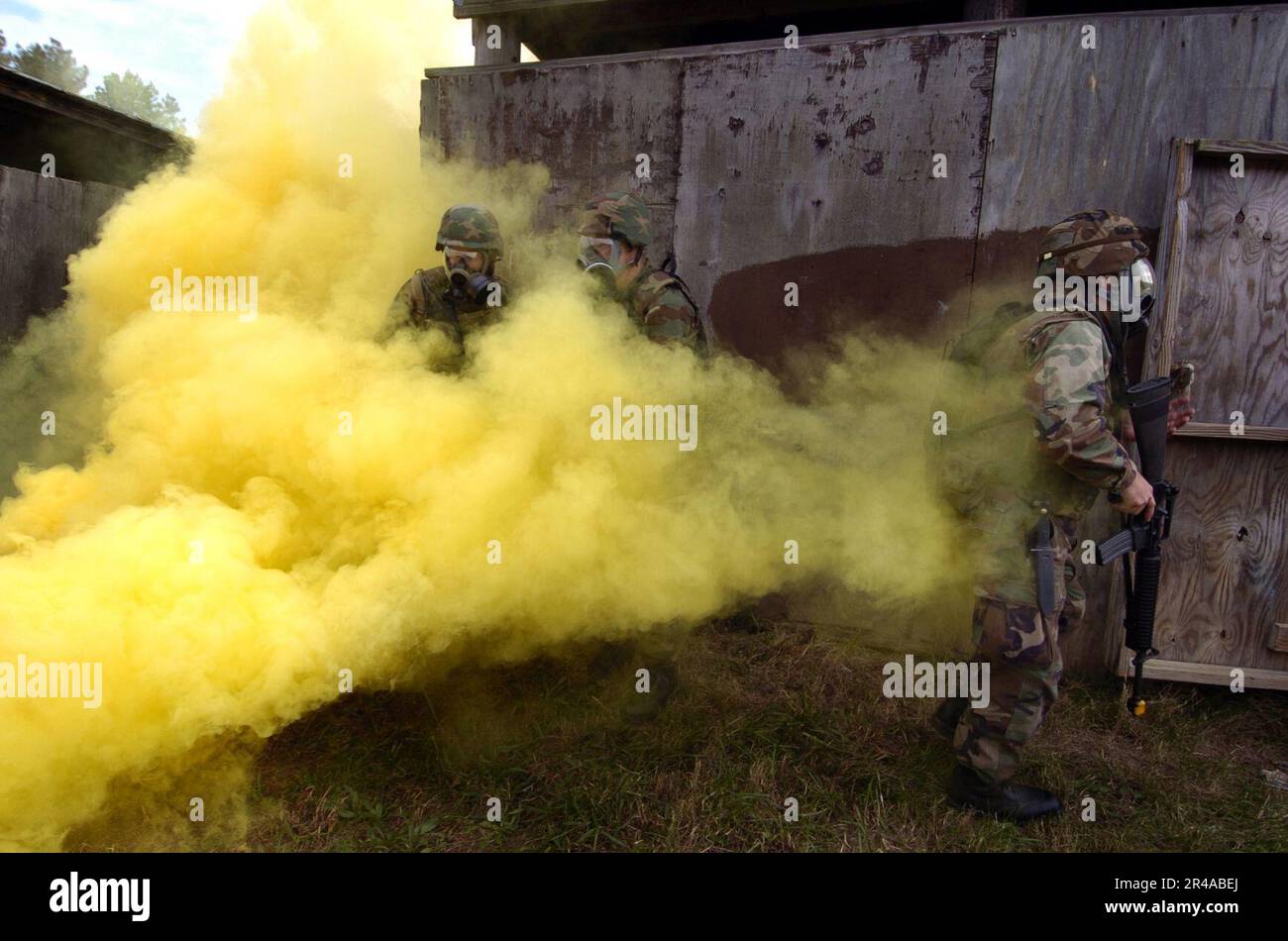 US Navy U.S. Navy combat camera personnel wear gas masks during a ...