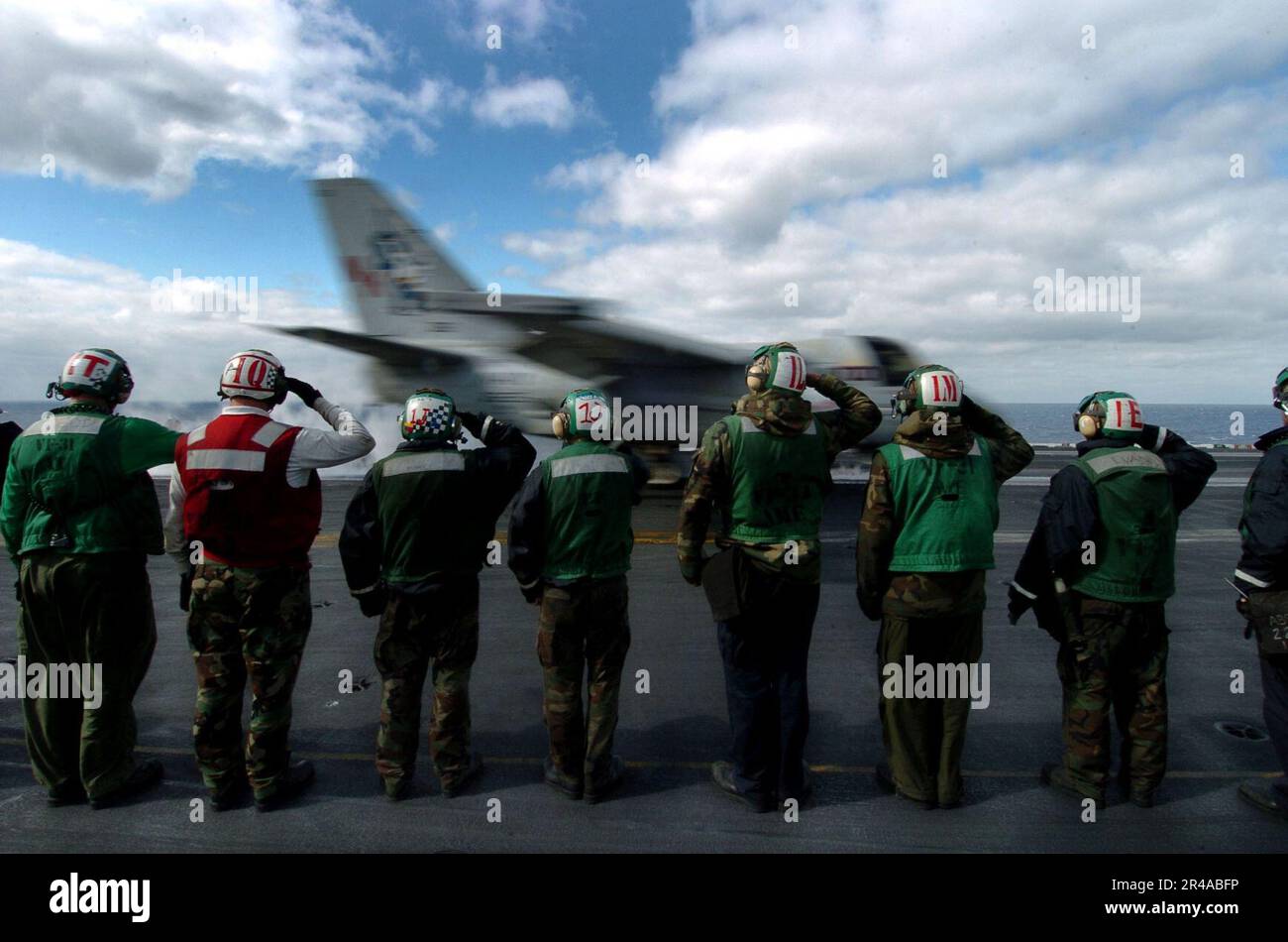 US Navy Flight deck personnel salute as the final S-3B Viking assigned ...