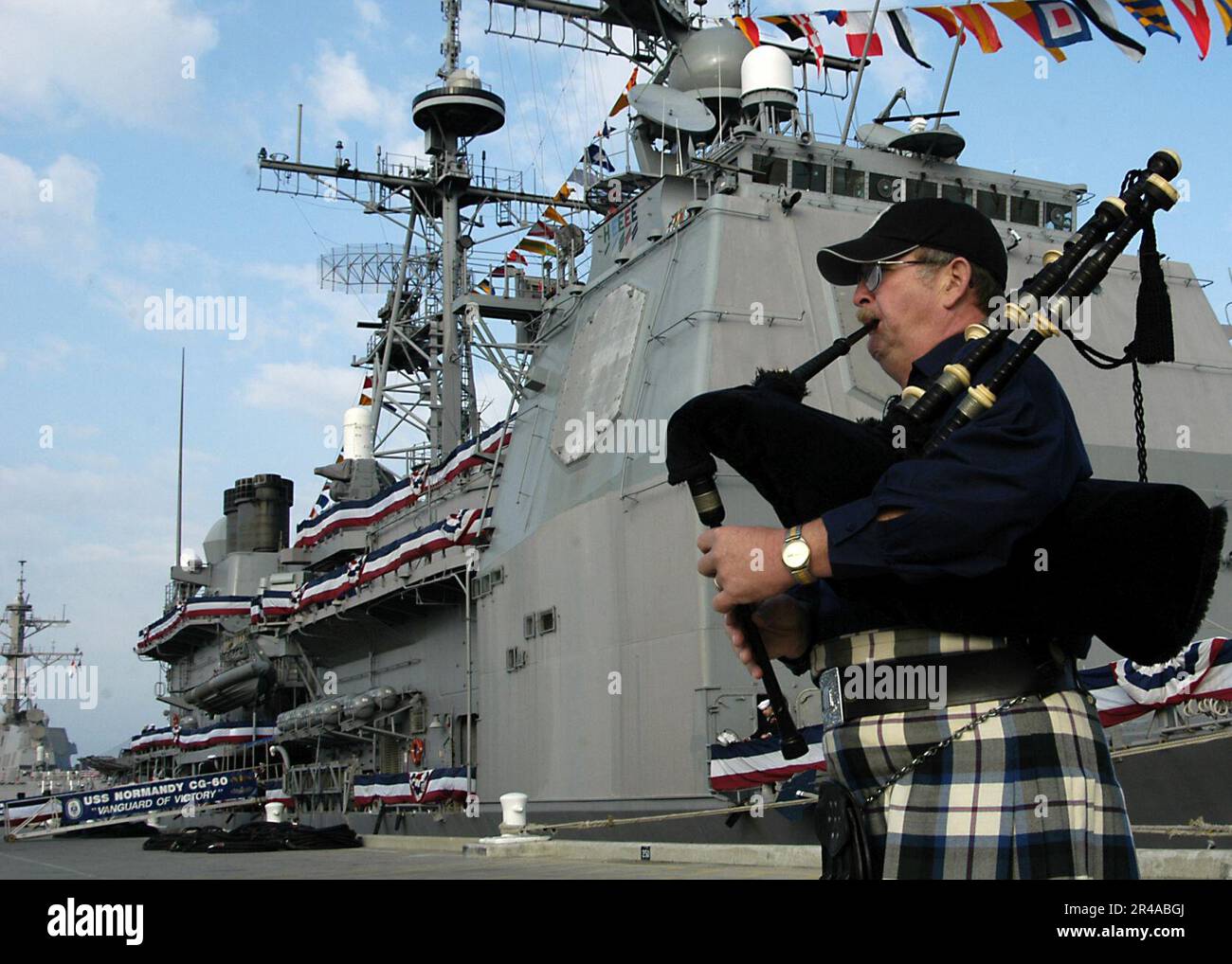 US Navy John Ickes of Virginia Beach, Va., plays the bagpipes before ...