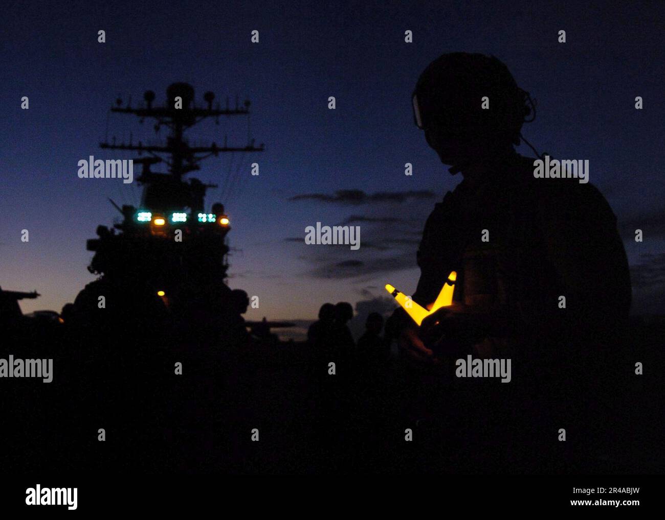 US Navy An Aviation Boatswain's Mate awaits the start of night flight ...