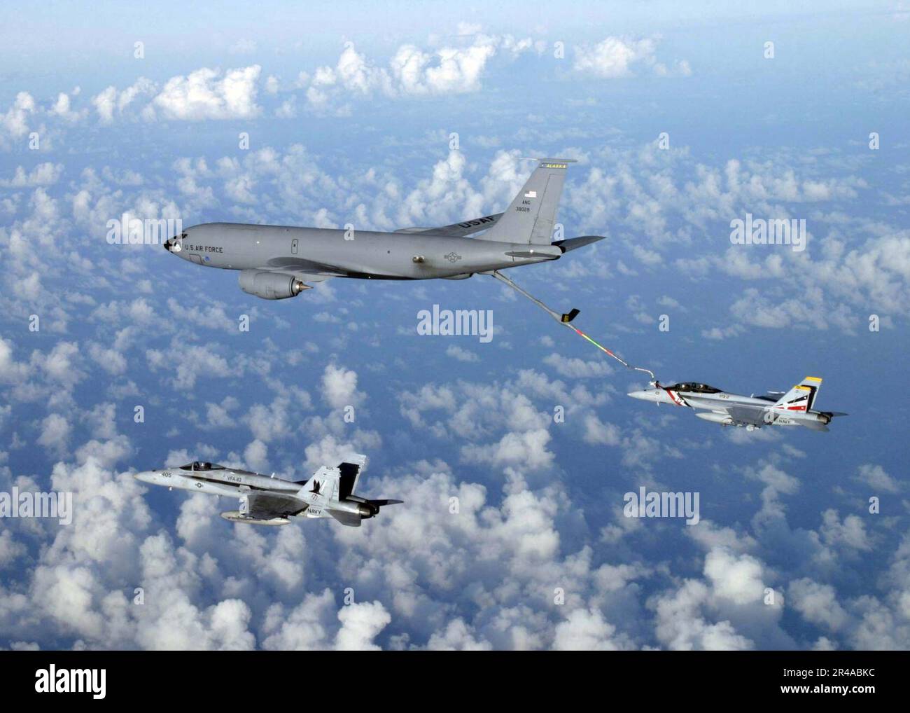 US Navy An F-A-18F Super Hornet and an F-A-18C Hornet conducts in-flight refueling from a U.S ...