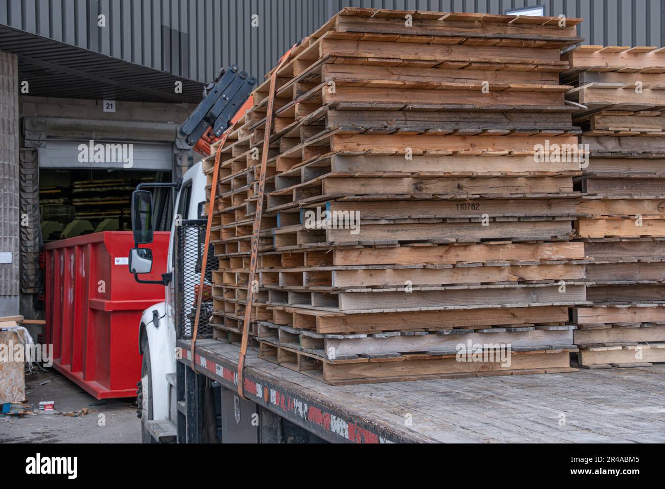 old recycled wood pallets for shipping products Stock Photo - Alamy