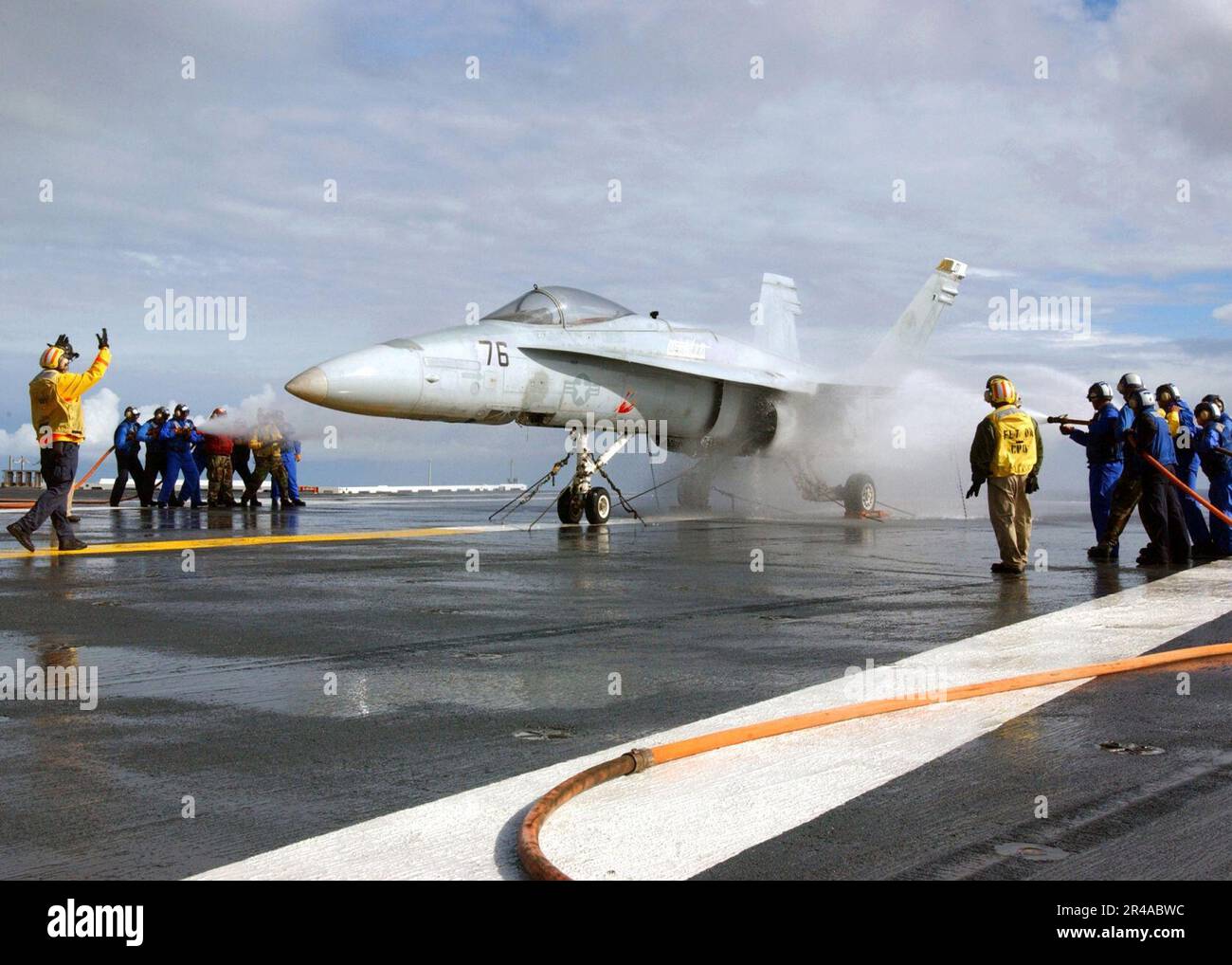 US Navy Air Department personnel approach a static training aircraft on ...