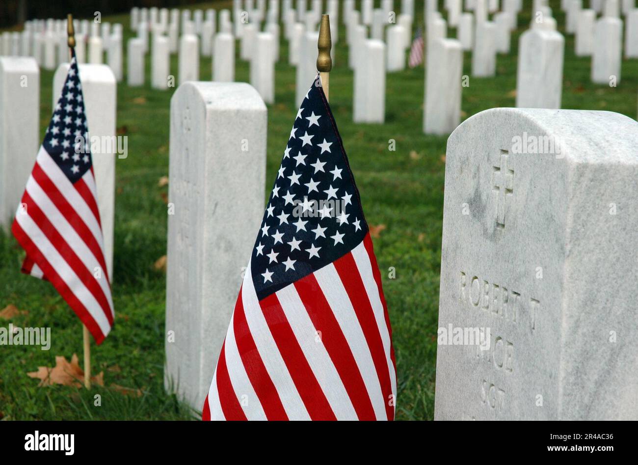 US Navy American flags decorate the headstones of service members at ...