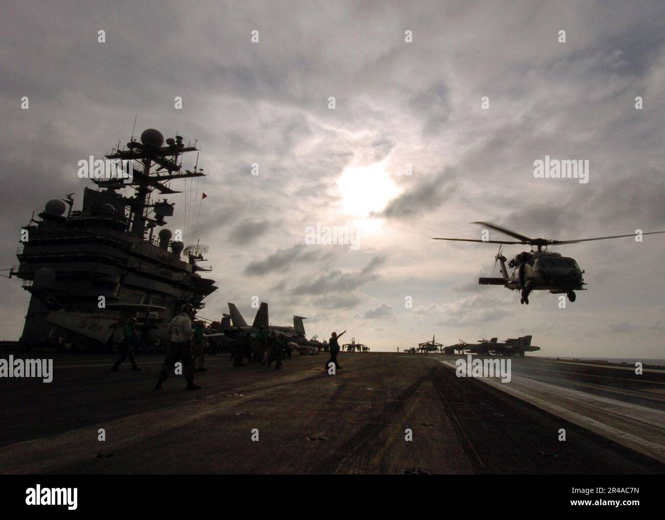 US Navy An HH-60H Seahawk helicopter takes-off from the flight deck aboard the Nimitz-class ...