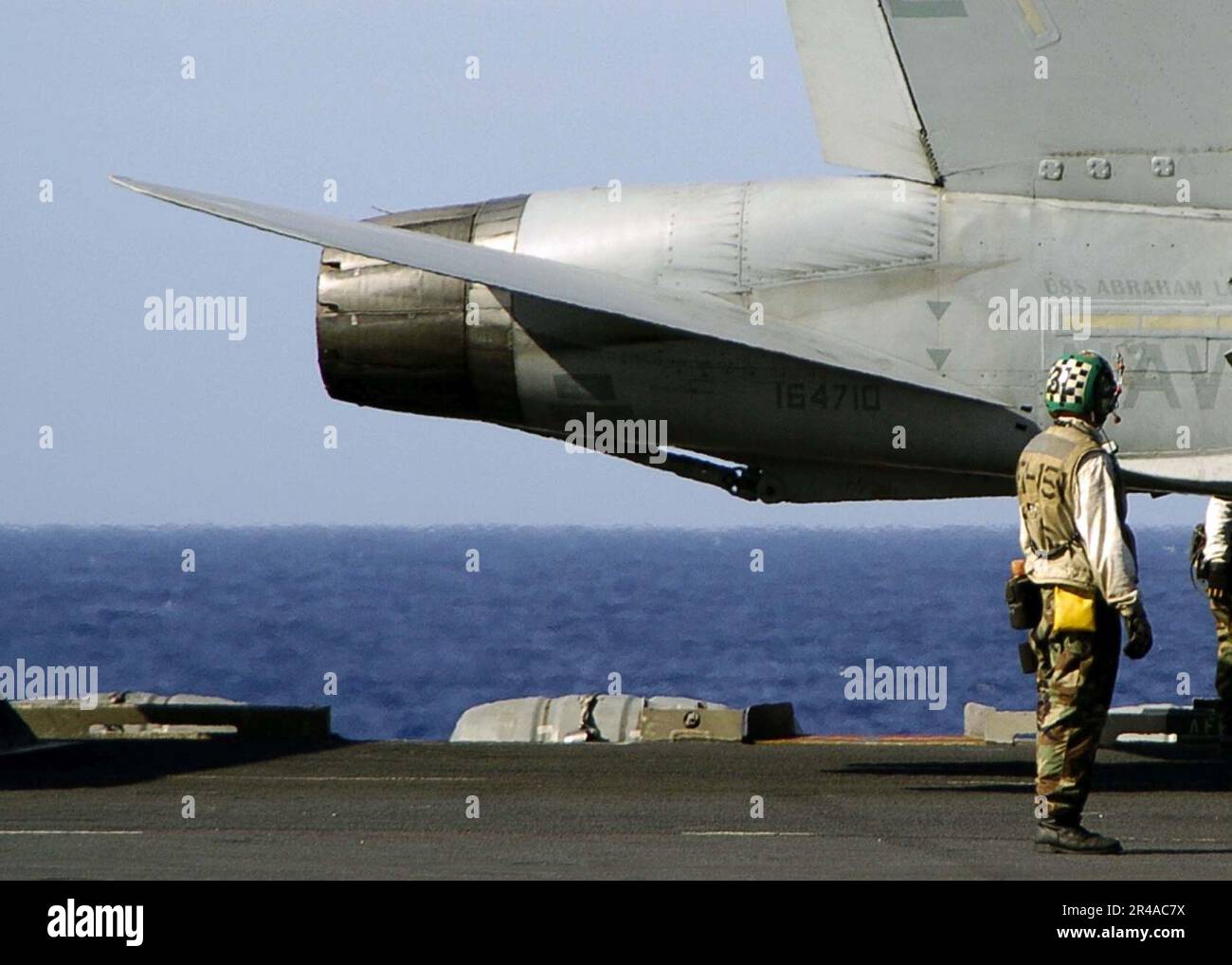 US Navy A final checker checks the tail wing of a F-A-18C Hornet from ...