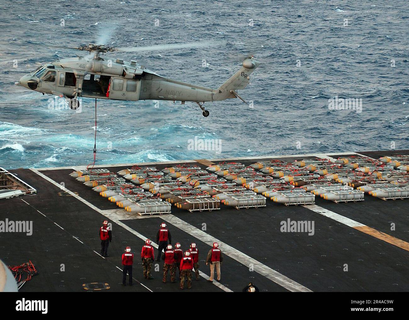 US Navy An MH-60S Knighthawk helicopter transports pallets of 2000 ...