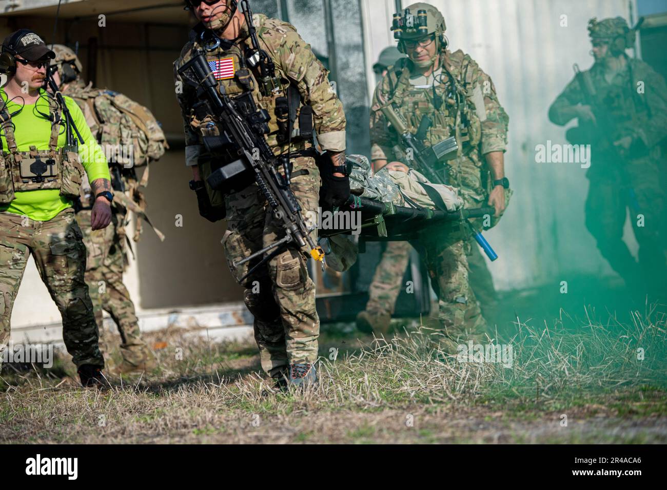 U.S. Air Force Pararescuemen from the 38th Rescue Squadron carry a ...