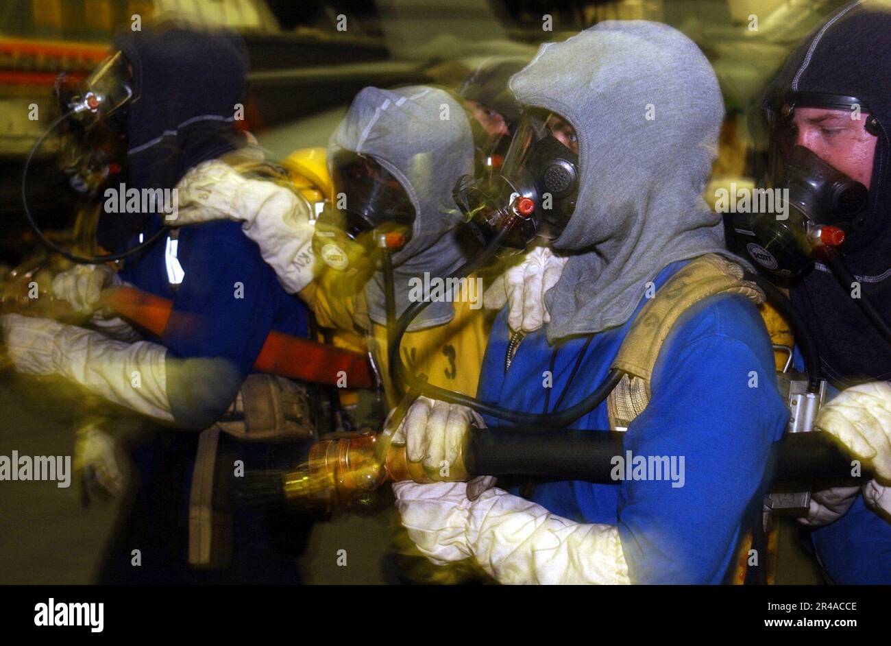 US Navy Repair Locker One Alpha's fire team advances on a simulated ...