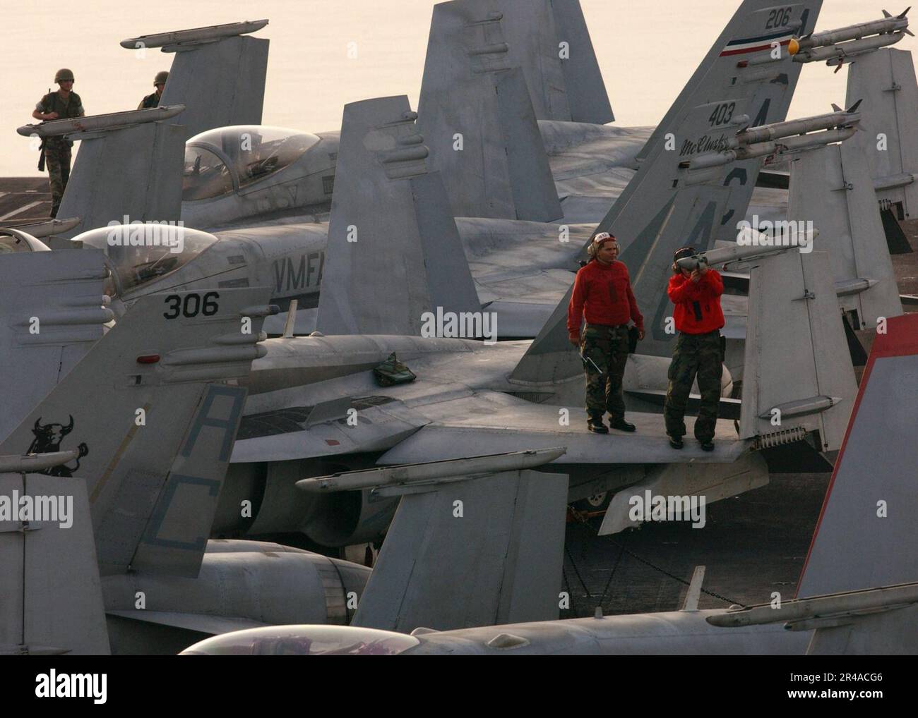 US Navy Two Aviation Ordnancemen assigned to the Gunslingers of Strike ...
