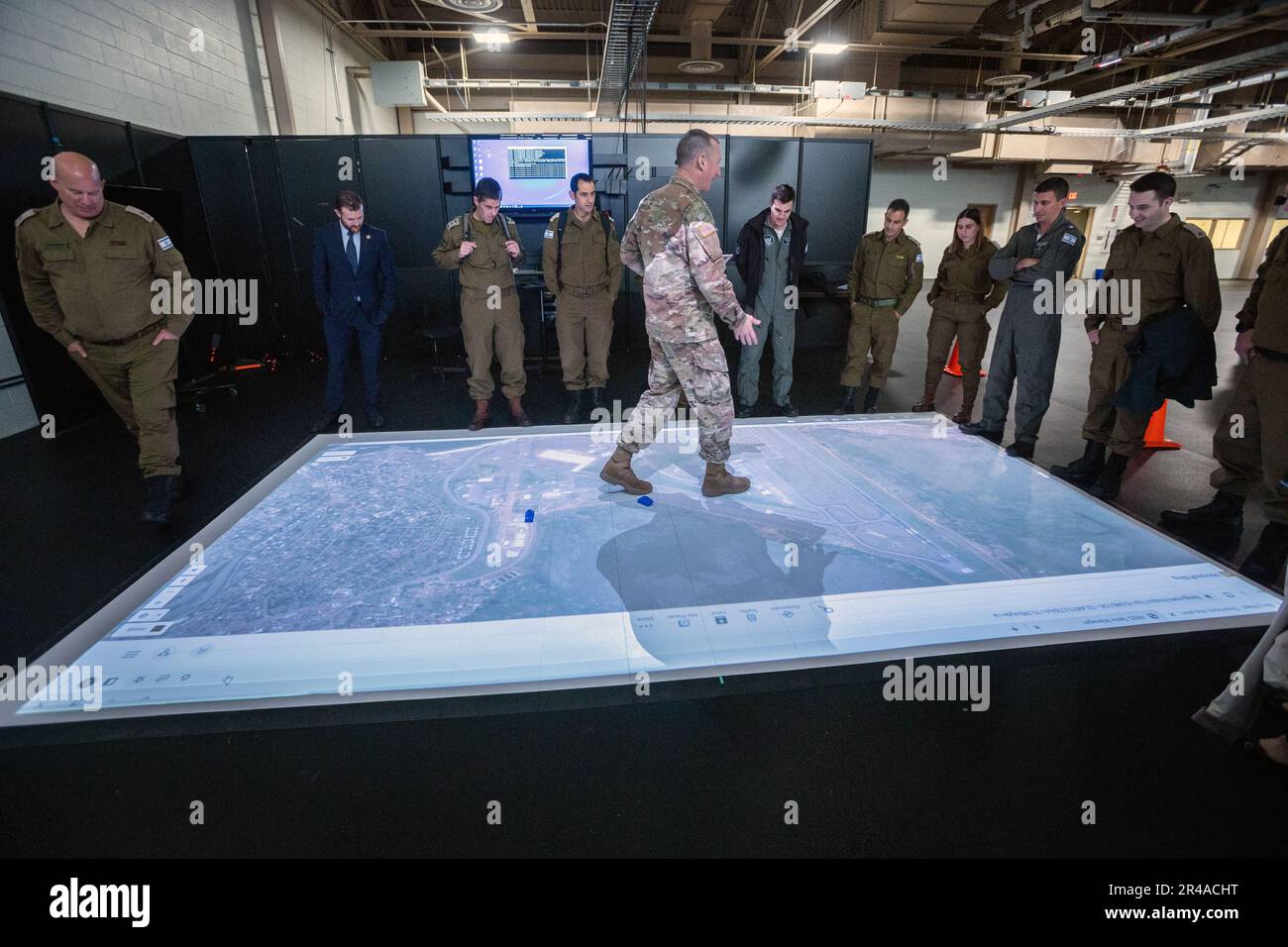 U.S. Army Master Sgt. Andrew P. Glatz, center, senior artillery ...