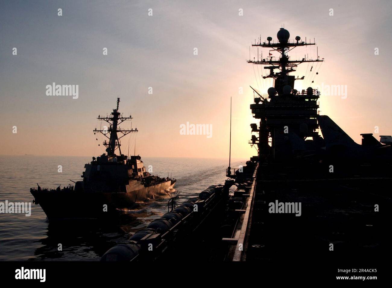 US Navy The Guided Missile Destroyer USS Barry (DDG 52) sails alongside ...