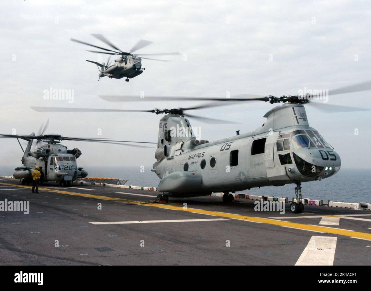 US Navy U.S. Marine CH-53E Super Stallions and a CH-46 Sea Knight ...