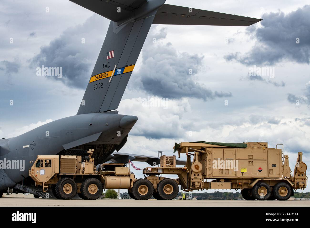 U.S. Army soldiers and Air Force airmen offload a surface-to-air ...