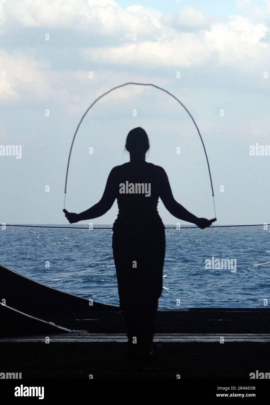 US Navy Aviation Electrician's Mate Amy Cruz jumps rope in the hanger ...