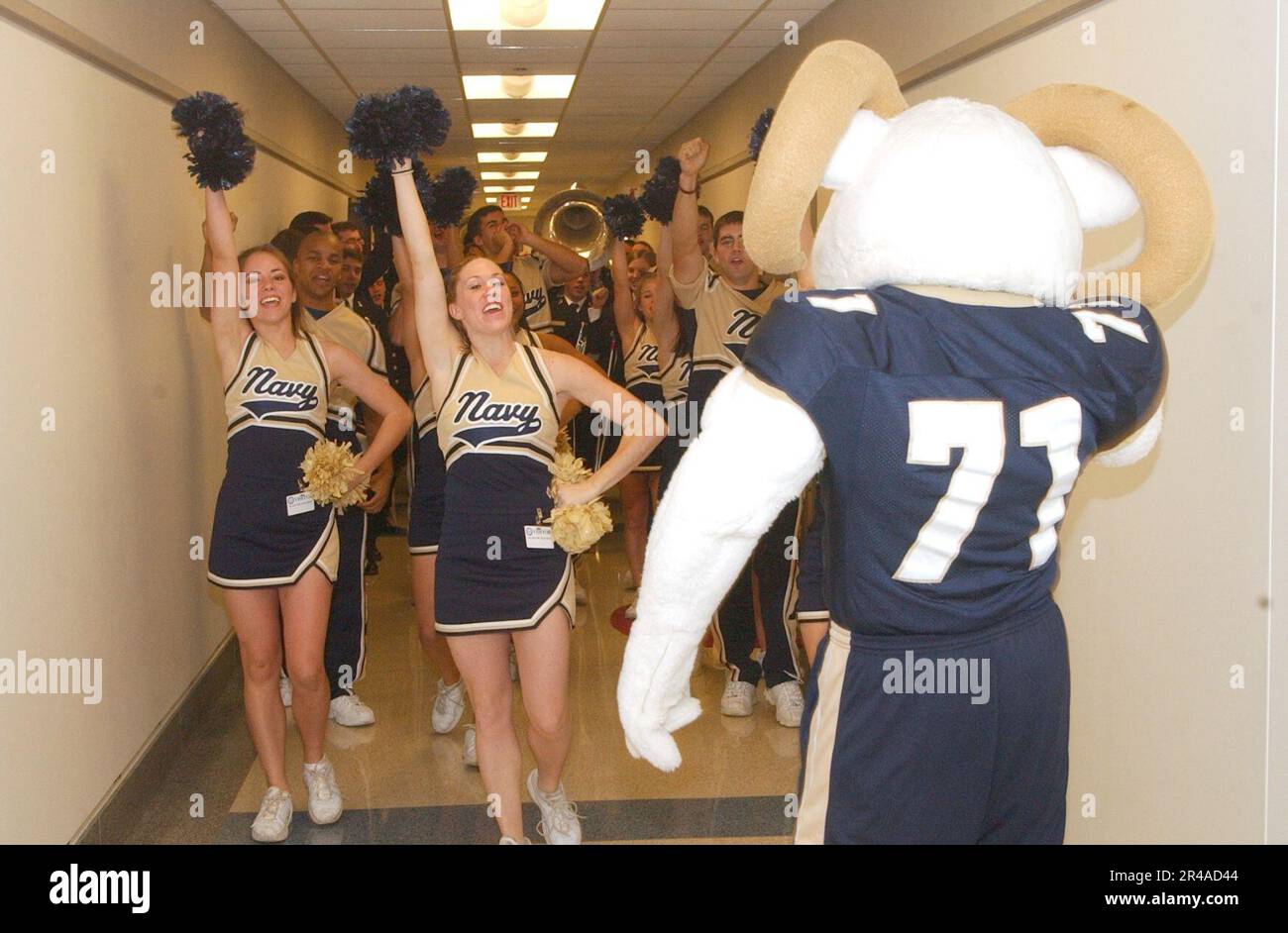 US Navy U.S. Naval Academy cheerleaders and mascot Bill the Goat kick ...