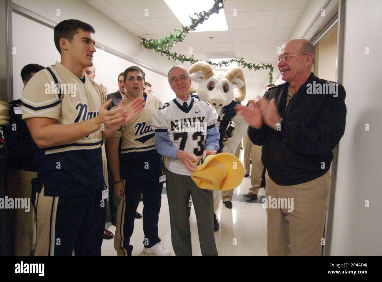 US Navy Secretary of the Navy (SECNAV) Gordon R. England, center, and ...