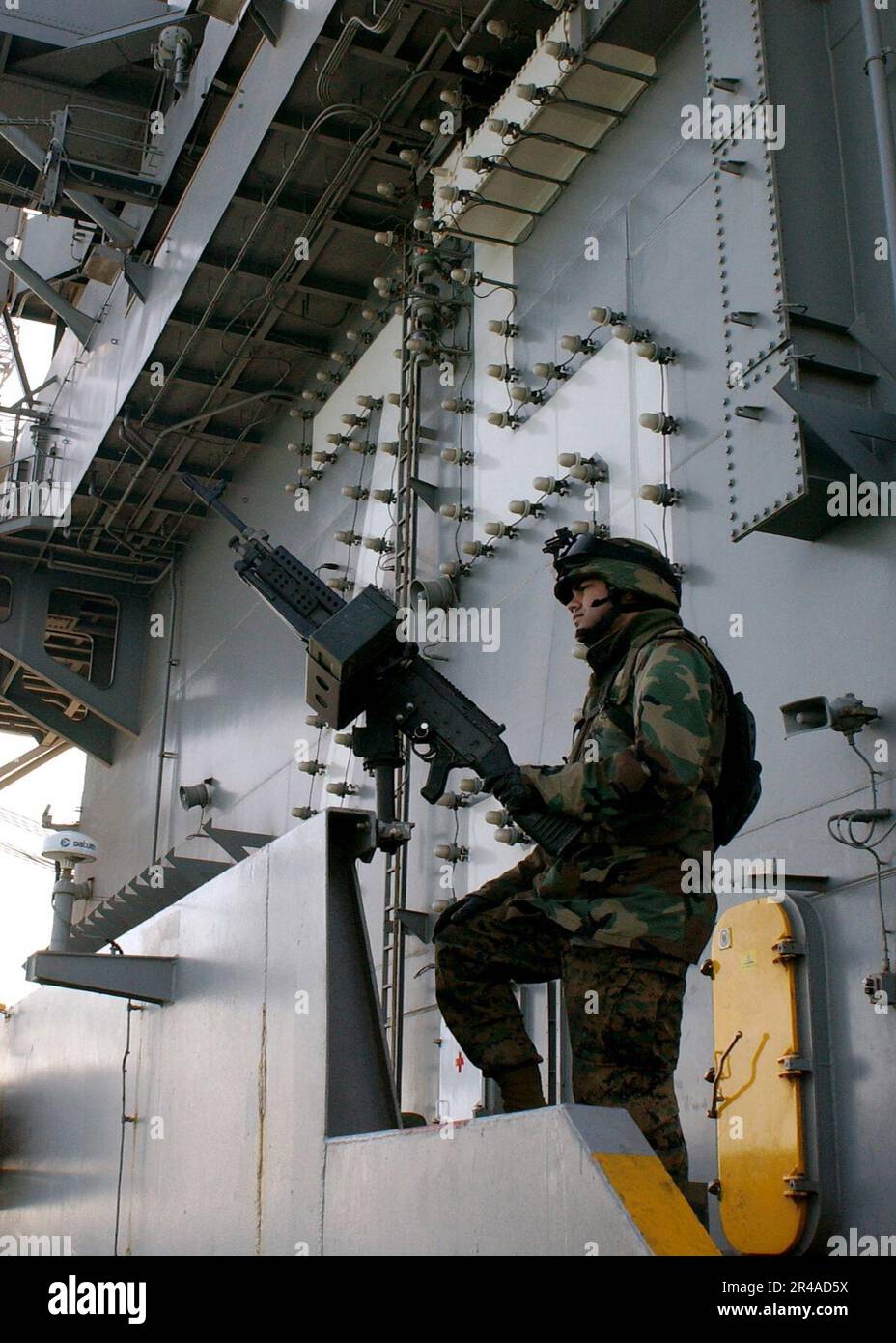 US Navy Marine Sgt. scans the horizon while manning the starboard M ...