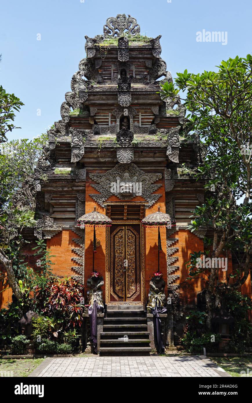 This stock photo features an ornate wooden gate of a Balinese temple in ...