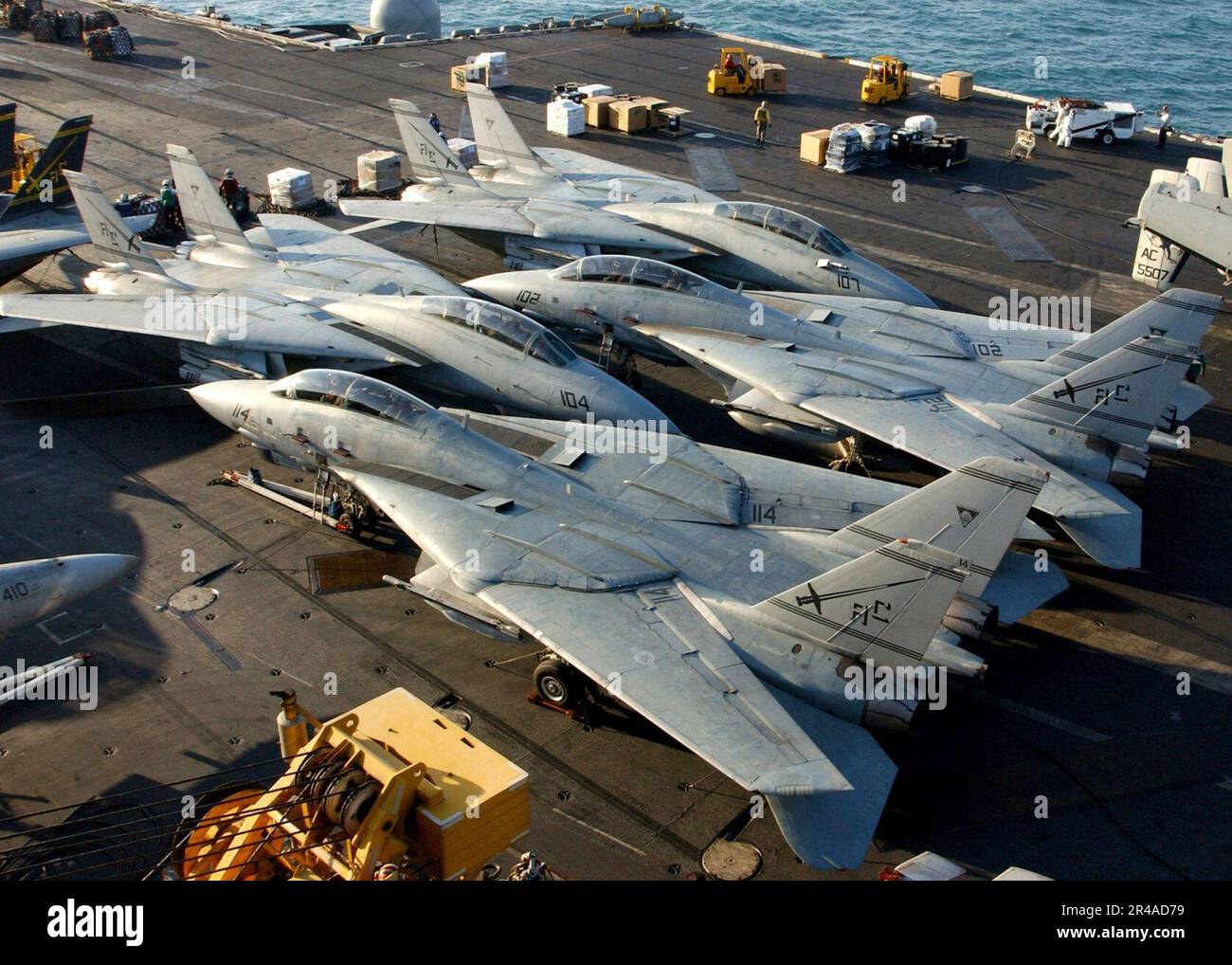 US Navy Sailors move food and supplies on the flight deck to one of ...