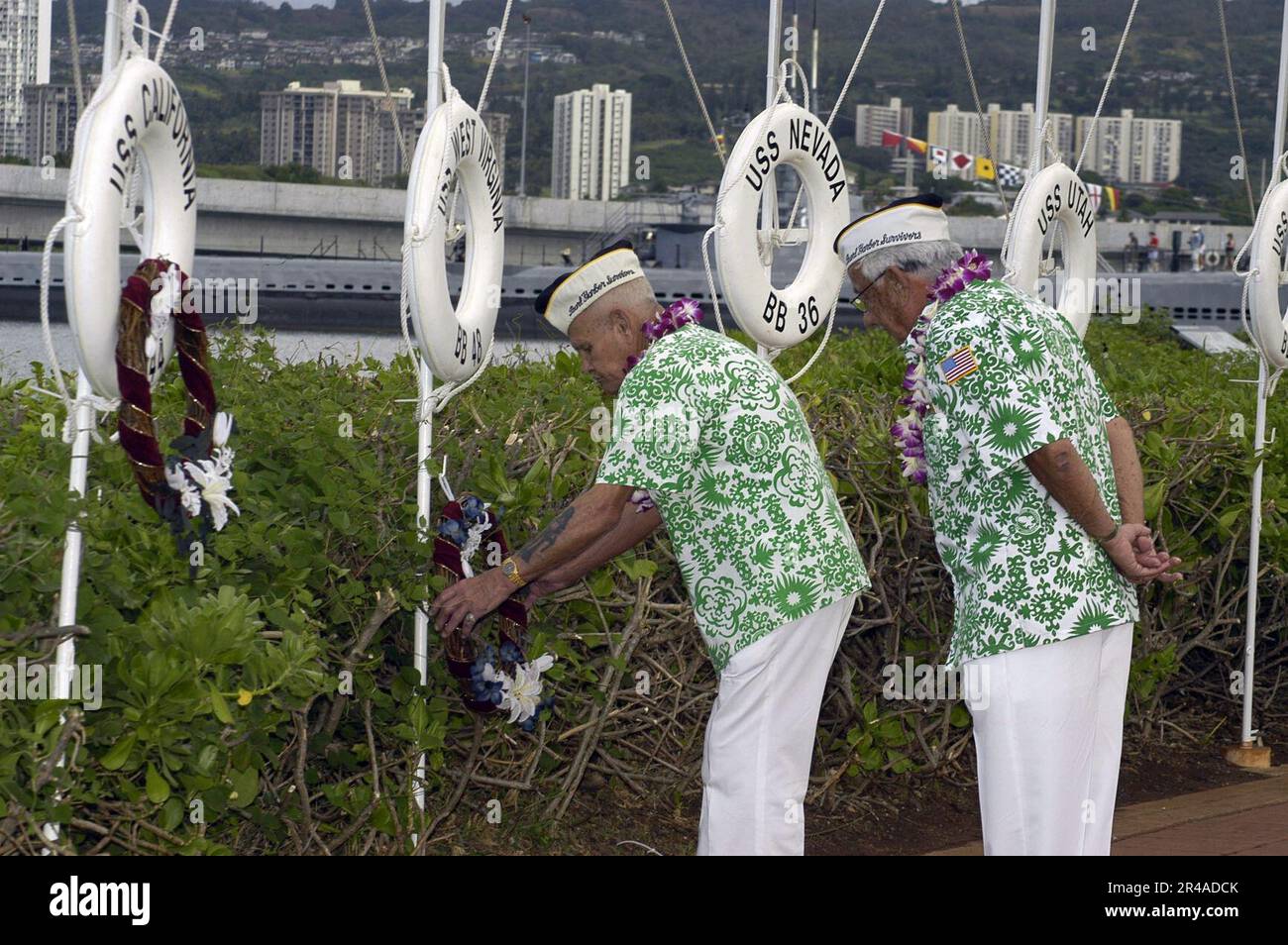 US Navy Al Rodrigues, left, a Pearl Harbor survivor, places a wreath on ...