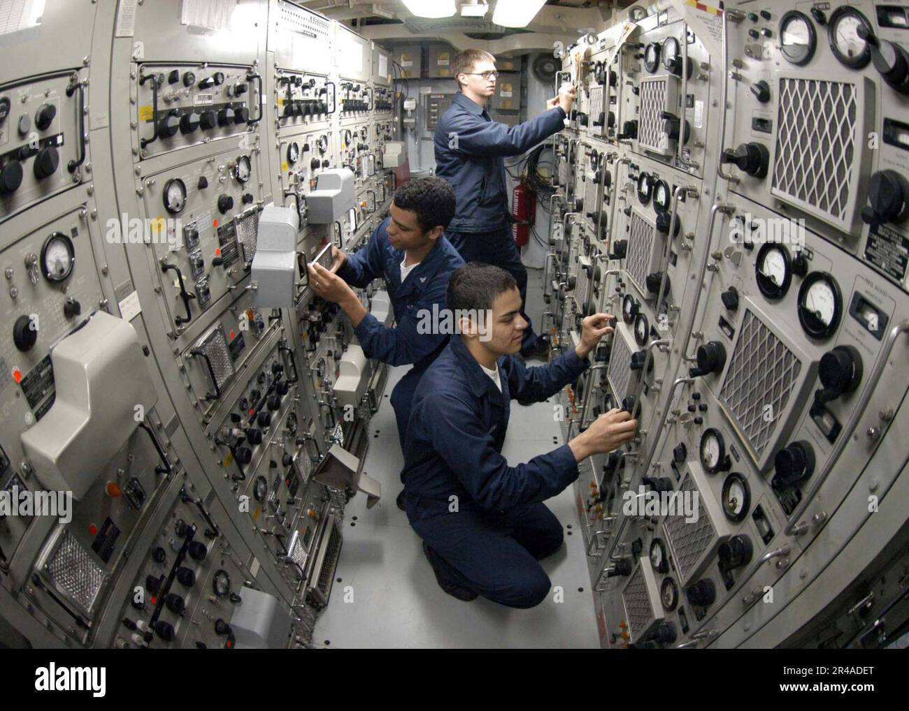 US Navy Sailors use high frequency radios and couplers aboard USS ...