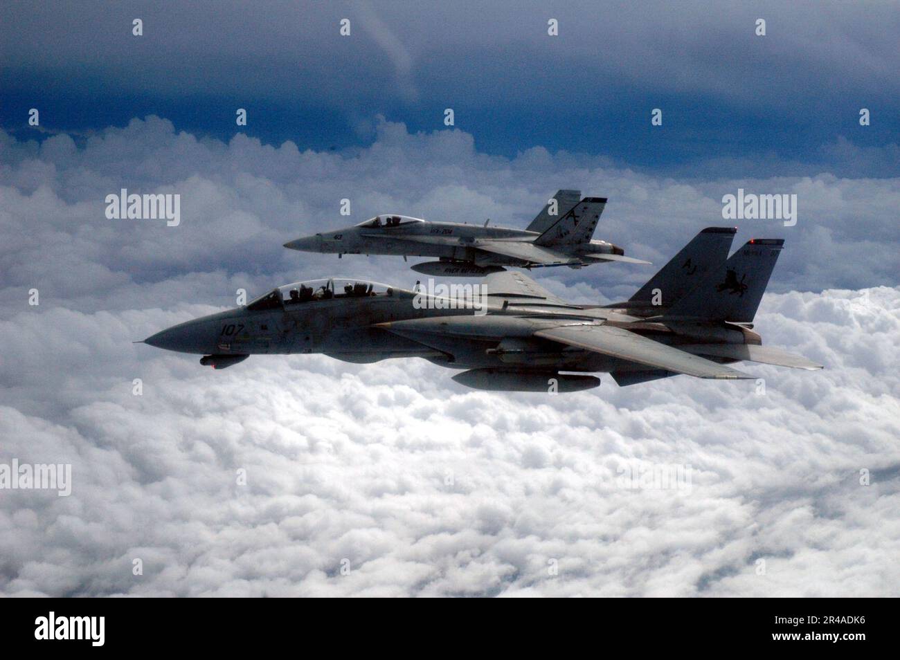 US Navy An F-14D Tomcat flies in a loose formation with an F-A-18A ...