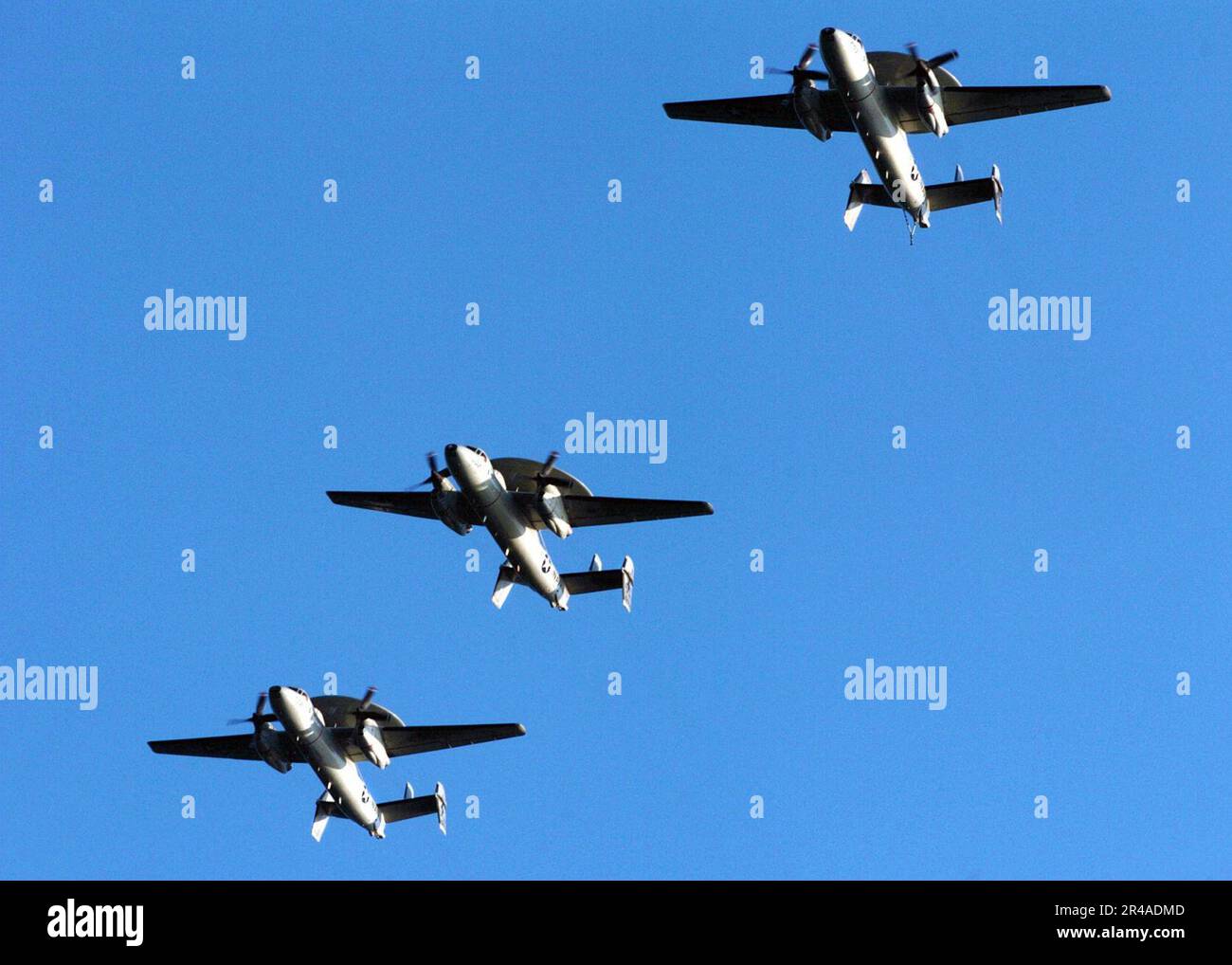 US Navy E-2C Hawkeyes ly over the Nimitz-class aircraft carrier USS ...